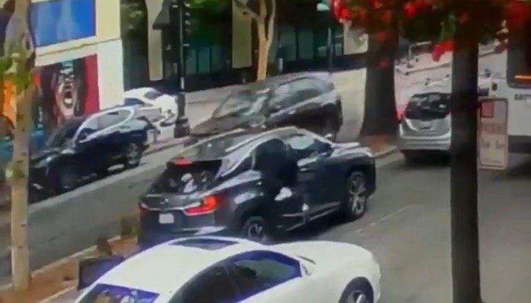 Thief Smashes Car Window, Climbs Into Vehicle and Robs Female Driver ...