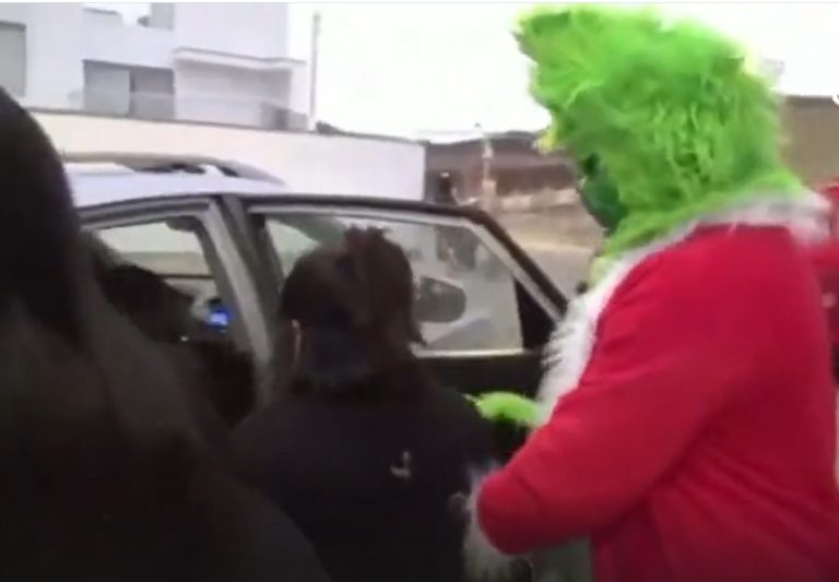 Police Officer Dressed as the Grinch Beats Door Open with Sledge Hammer ...